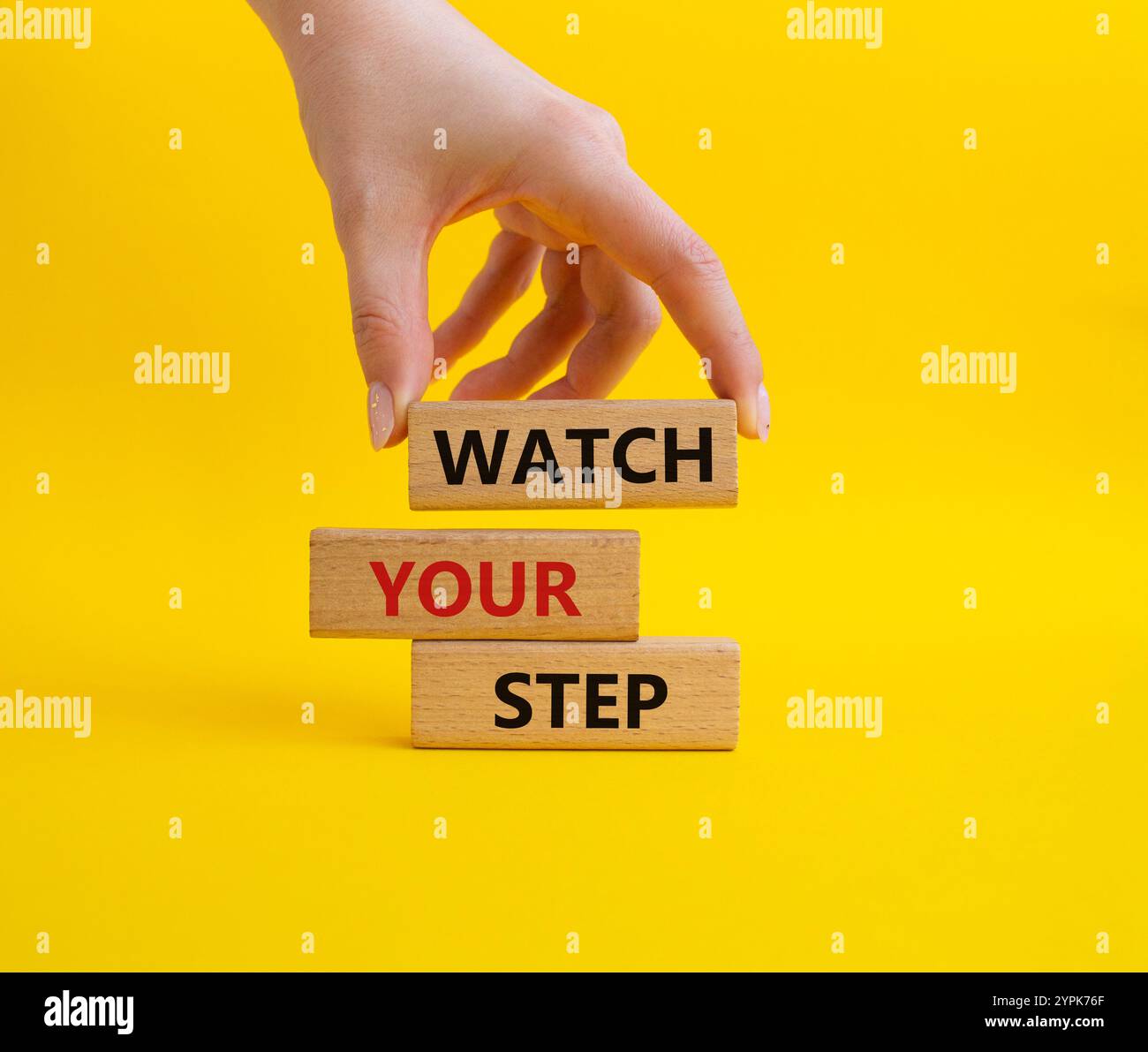 Watch your Step symbol. Concept words Watch your Step on wooden blocks ...