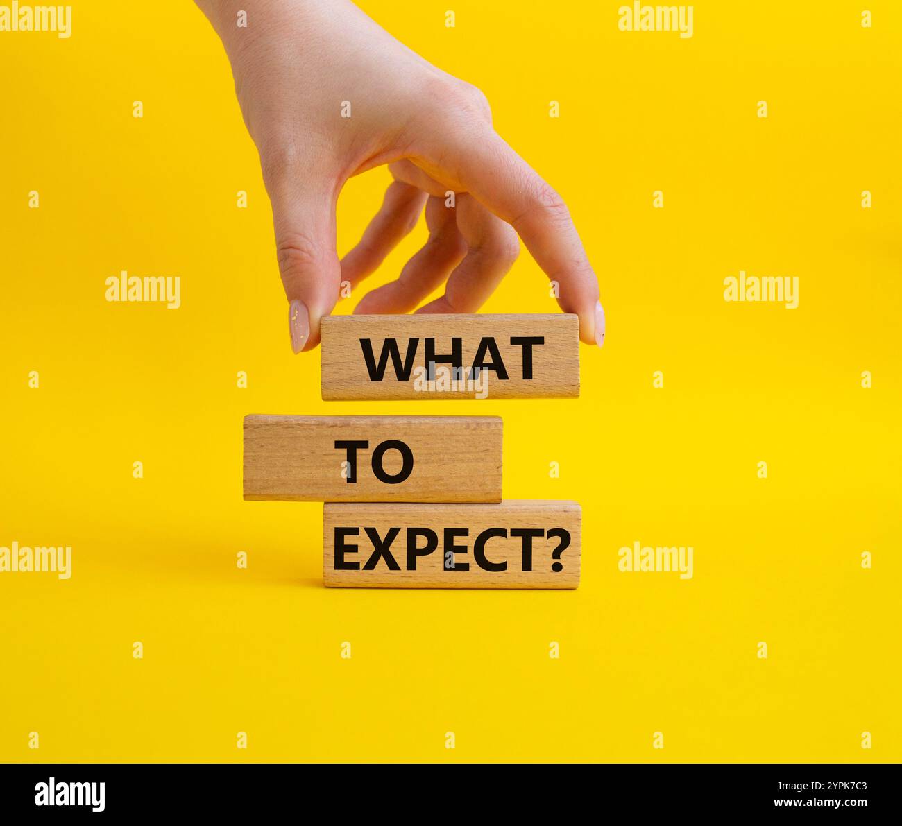 What to Expect symbol. Concept words What to Expect on wooden blocks ...