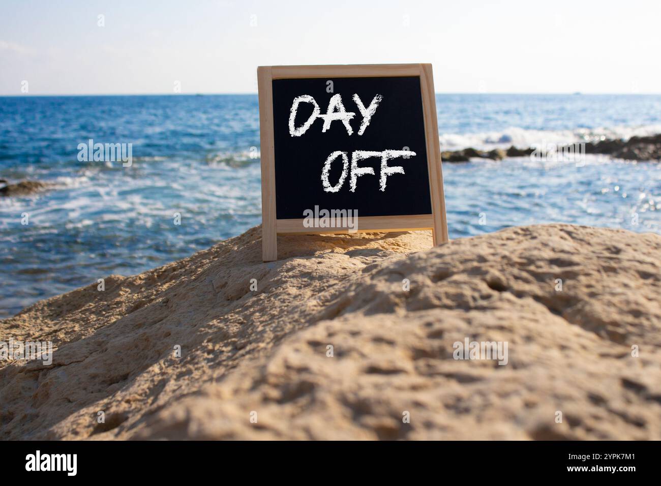 Day off symbol. Day off black chalk blackboard. Beautiful sea ...