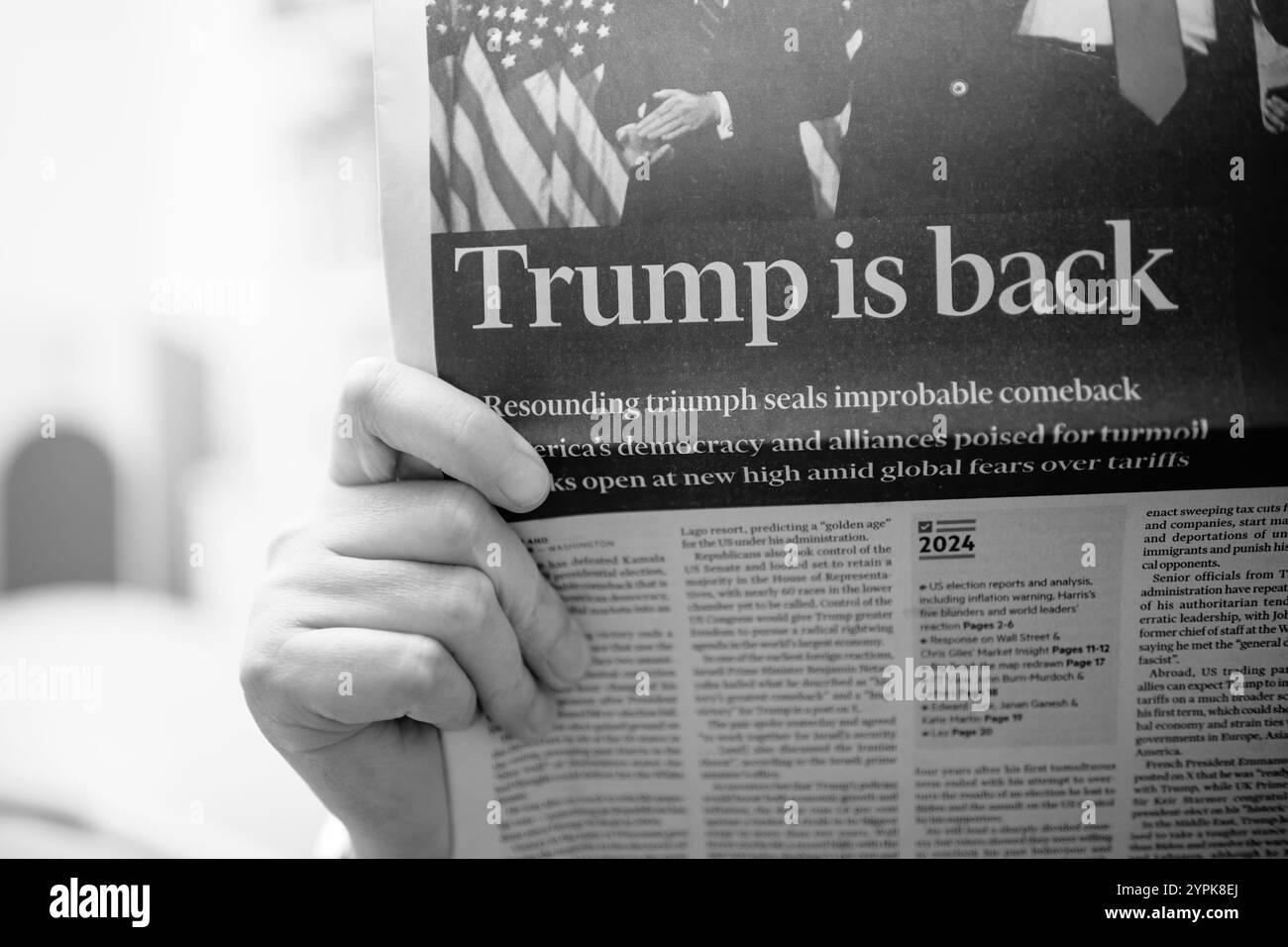 Paris, France - Nov 13, 2024: A black-and-white close-up of a hand ...