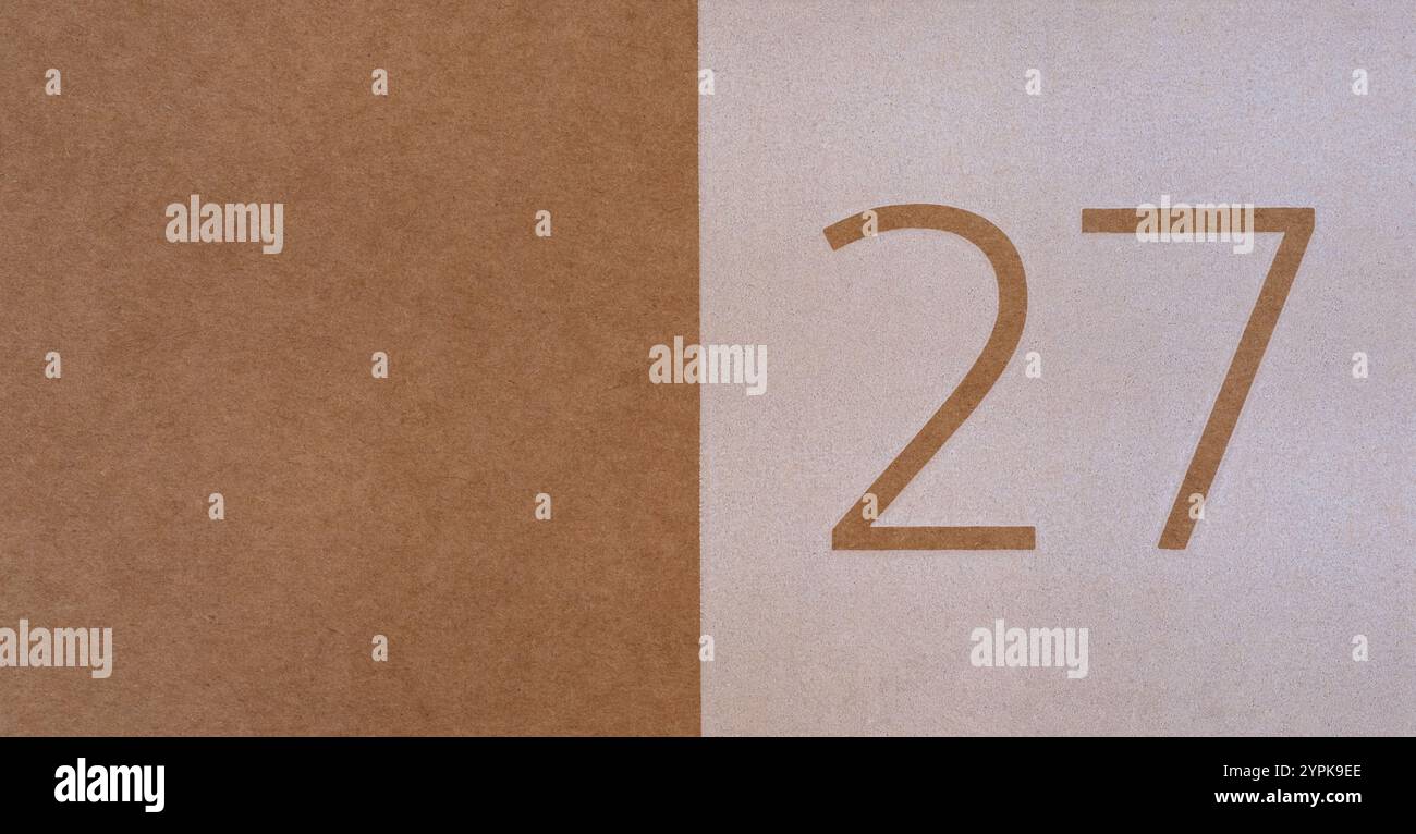 Number 27 on white half of a cardboard background Stock Photo - Alamy