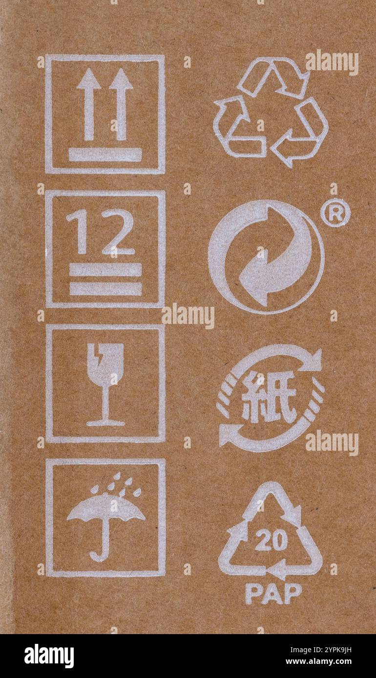 Transit packaging symbols on a cardboard box background Stock Photo - Alamy
