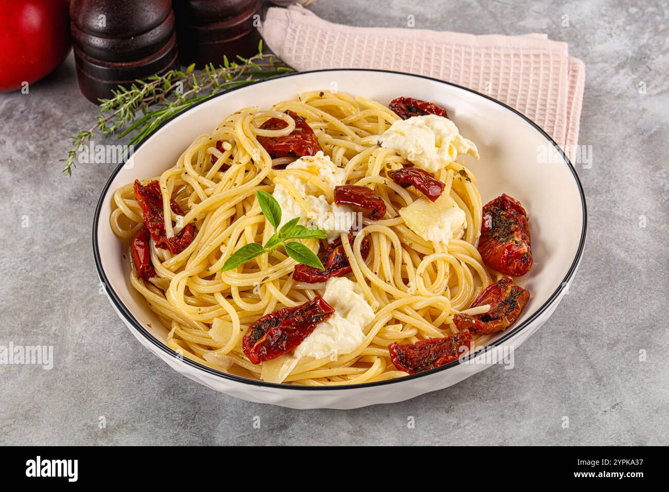Italian pasta spaghetti with stracciatella and tomato Stock Photo - Alamy