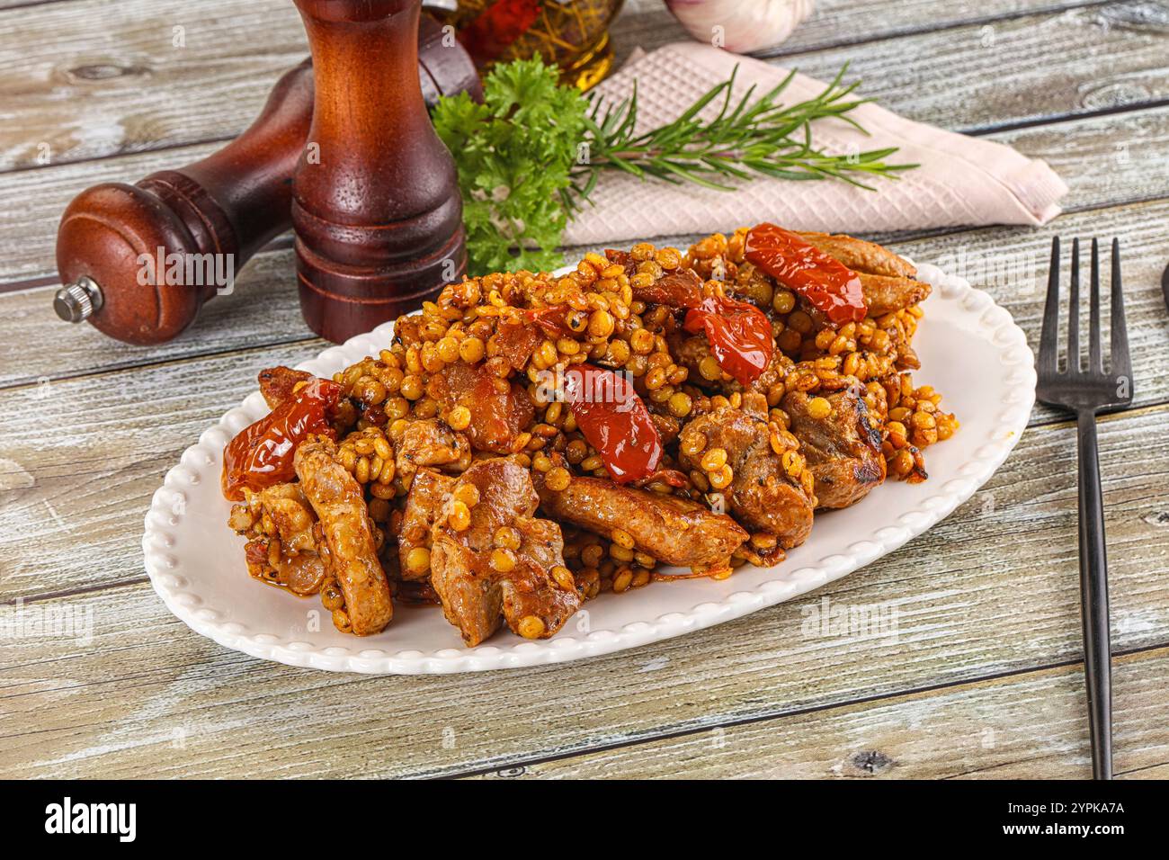 Rasted chicken meat with ptitim and vegetables Stock Photo - Alamy