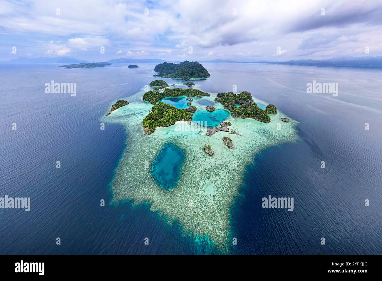 Aerial view of an island chain archipelago, karst islands with lush vegetation surrounded with ...