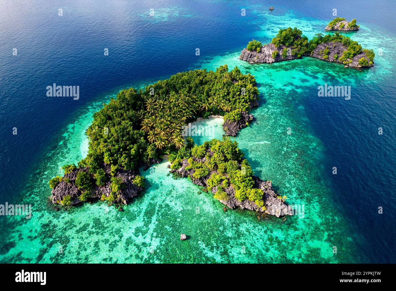 Aerial view of beautiful small island covered in lush tropical ...