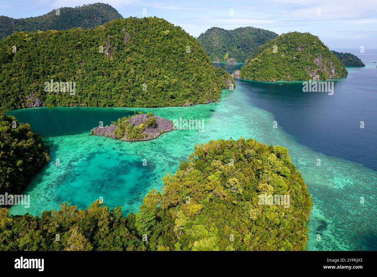 Aerial view of spectacular lagoons and blue holes, small islands ...