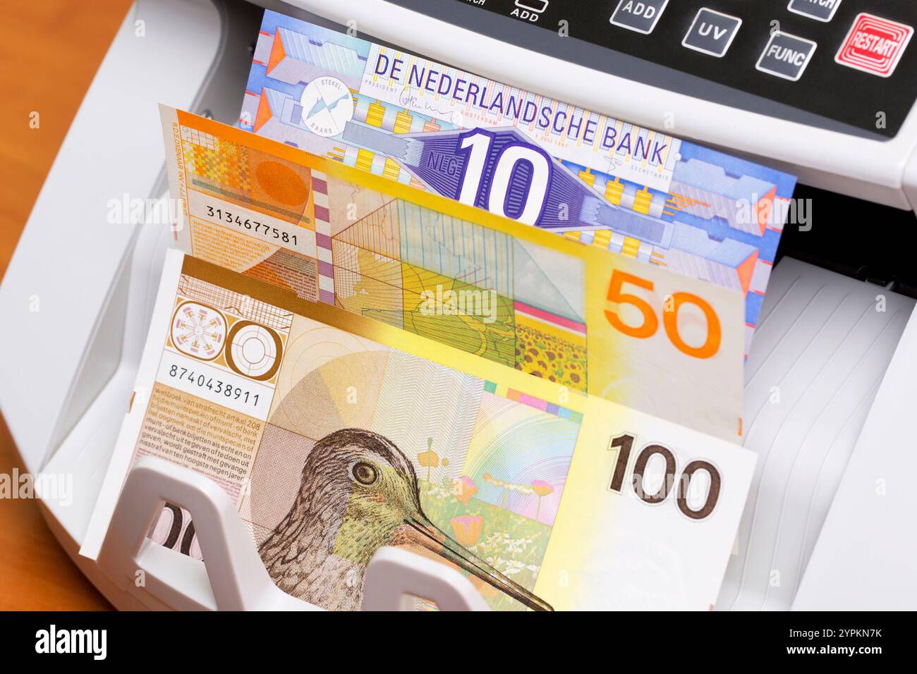 Dutch money - guilder in the counting machine Stock Photo - Alamy
