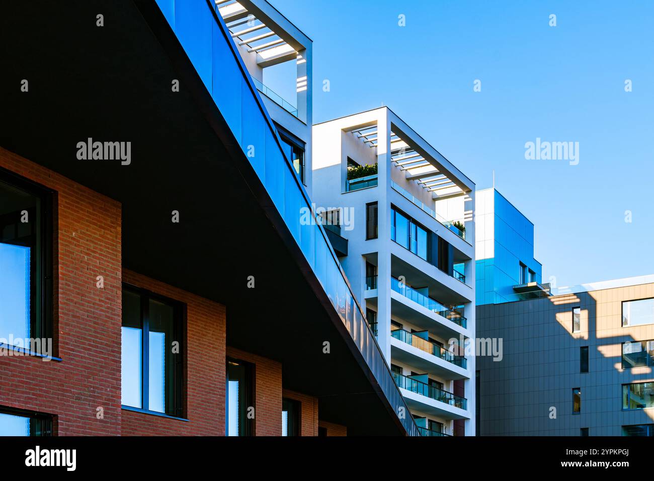 Contemporary Residential Buildings with Modern Balconies, Brick Facades ...