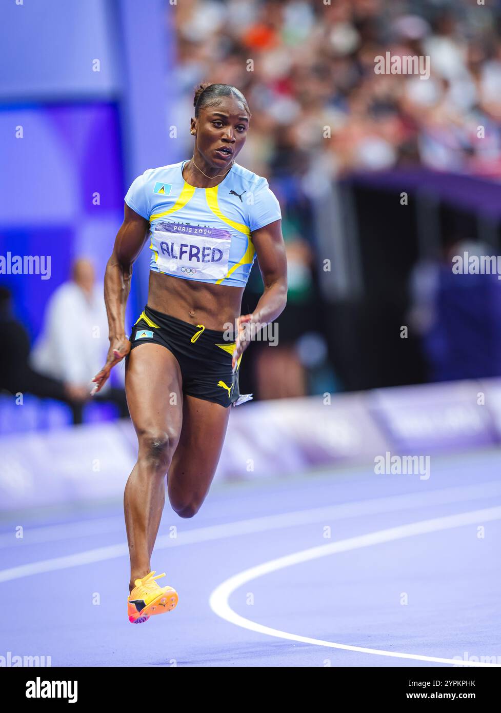 Julien Alfred participating in the 200 meters relay at the Paris 2024 ...