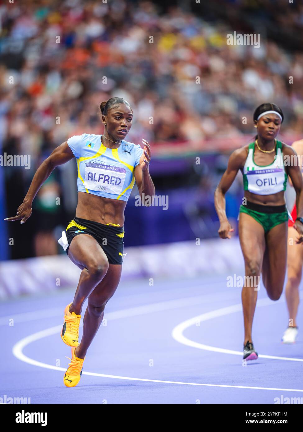 Julien Alfred participating in the 200 meters relay at the Paris 2024 ...