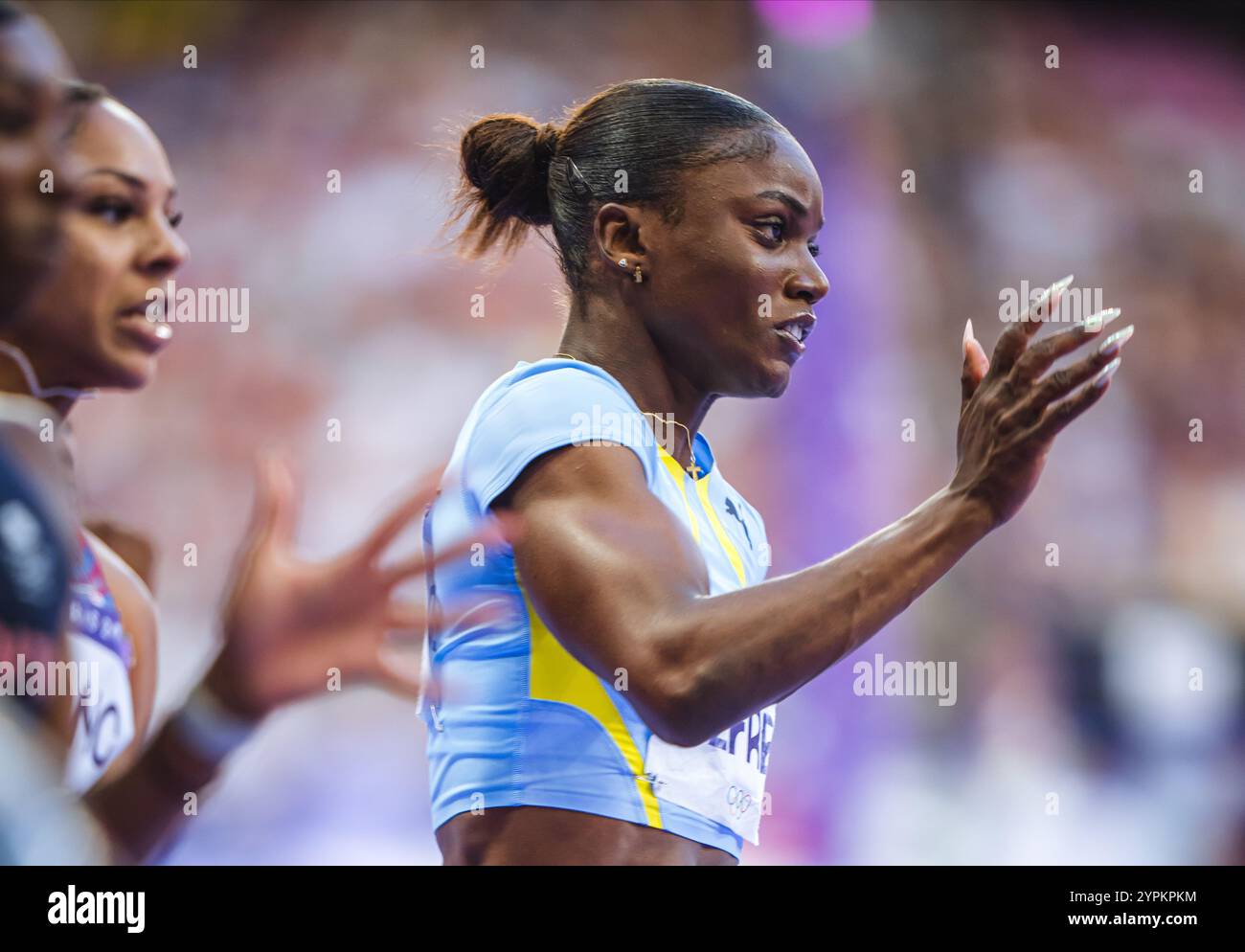 Julien Alfred participating in the 200 meters relay at the Paris 2024 ...