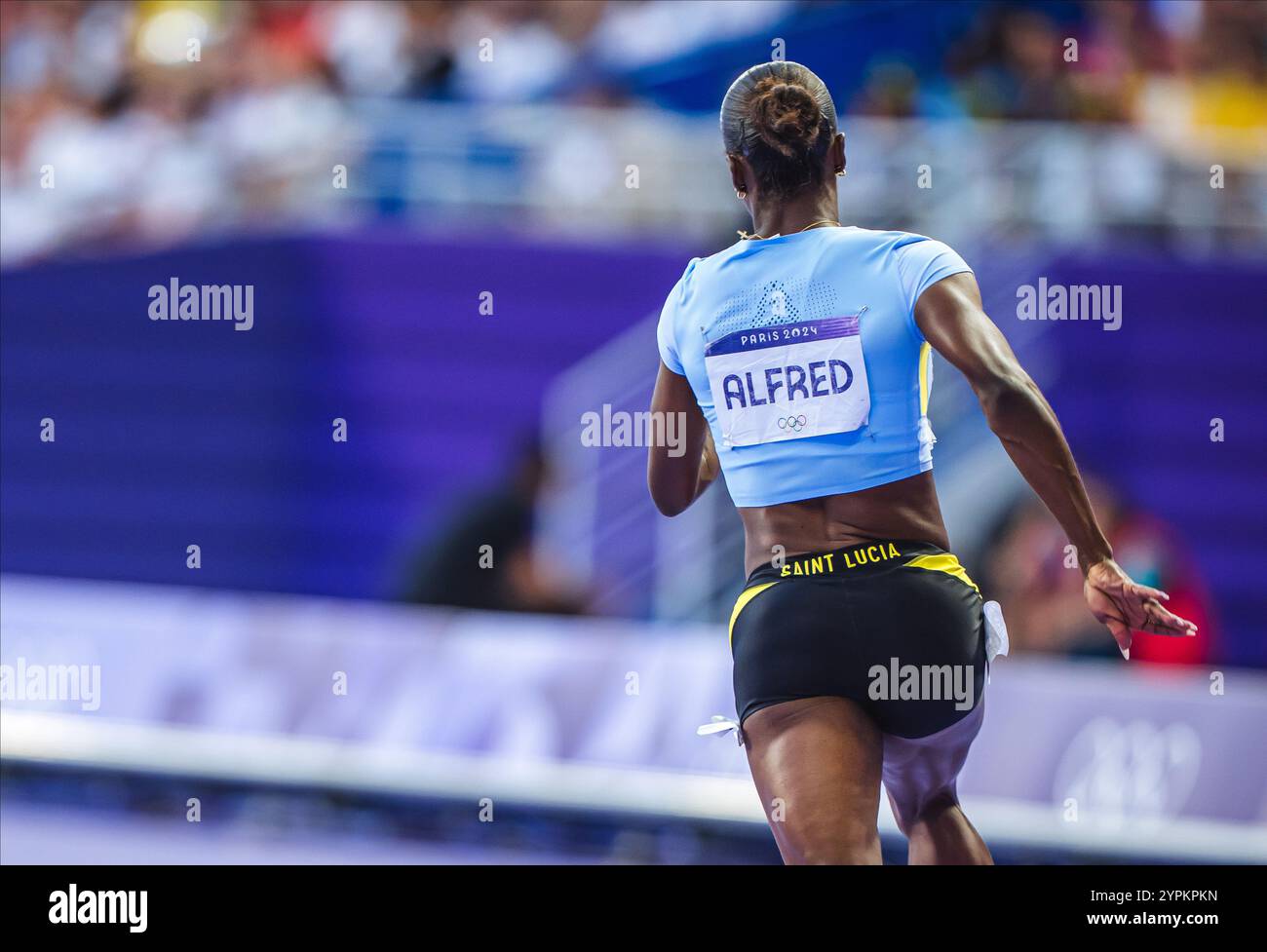 Julien Alfred participating in the 200 meters relay at the Paris 2024 ...