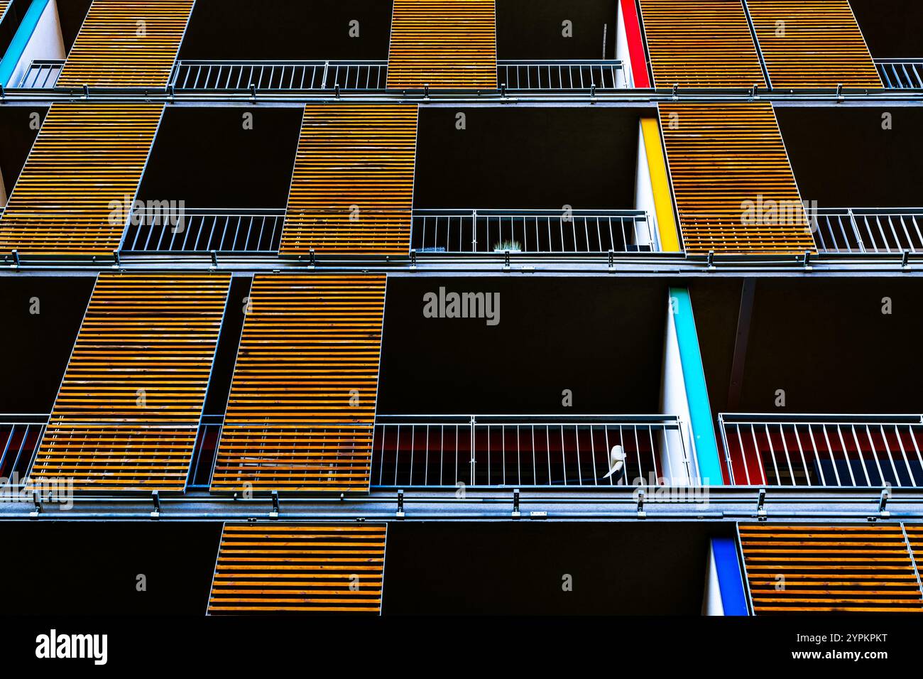 Modern Apartment Building Facade with Vibrant Yellow Wooden Panels and ...