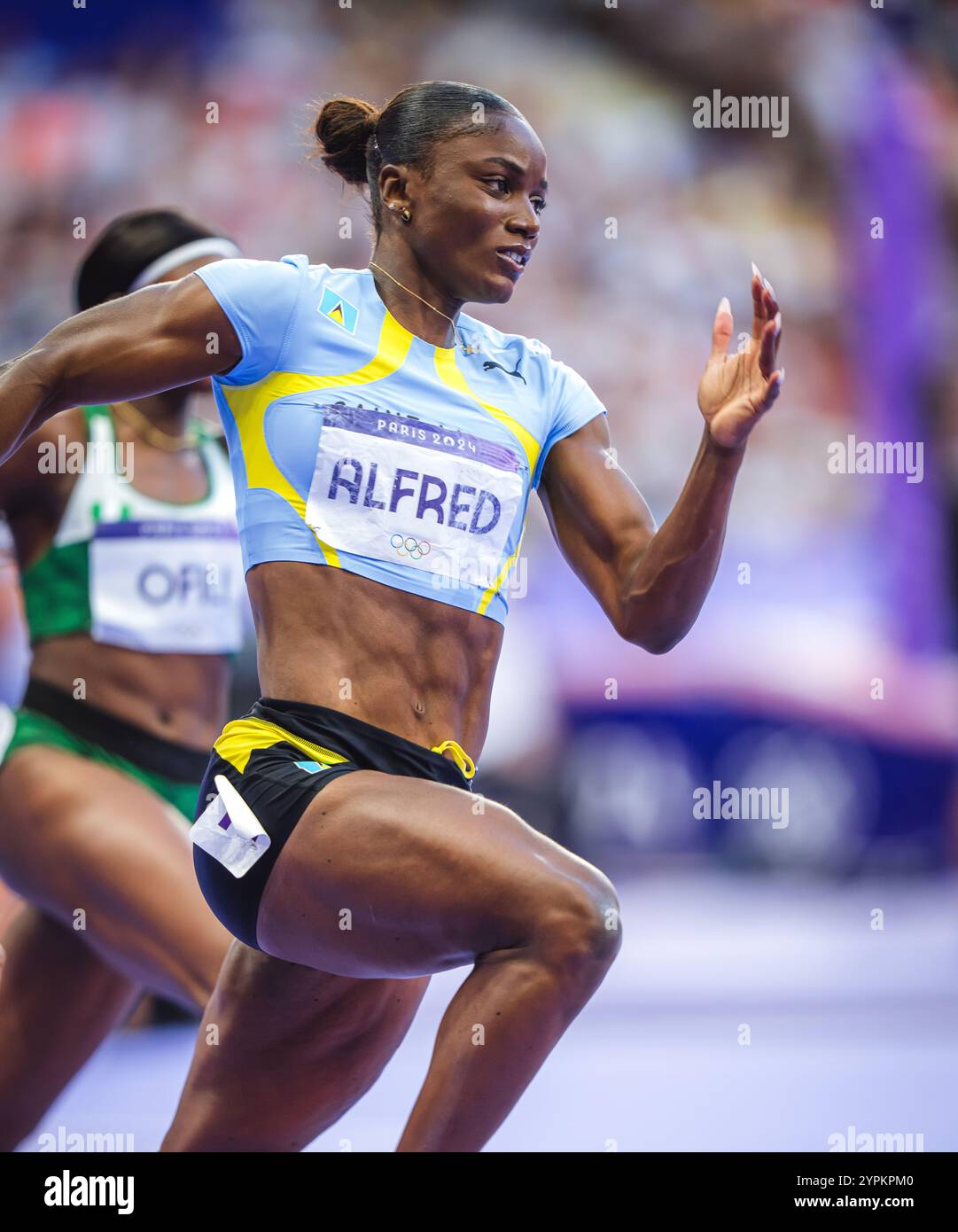 Julien Alfred participating in the 200 meters relay at the Paris 2024 ...