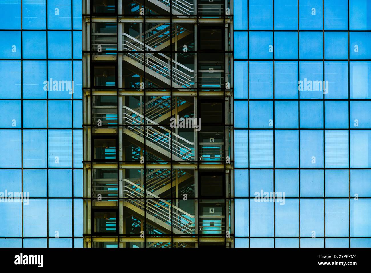 Modern Glass Facade Showcasing Internal Staircases with Symmetrical ...