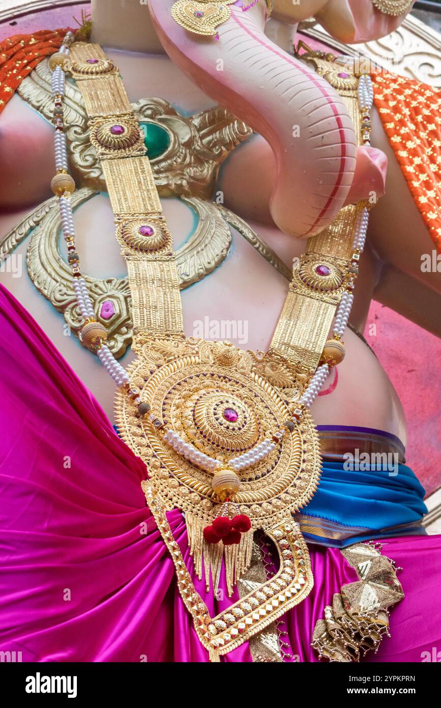 A beautiful idol of Lord Ganpati being displayed in a procession called ...