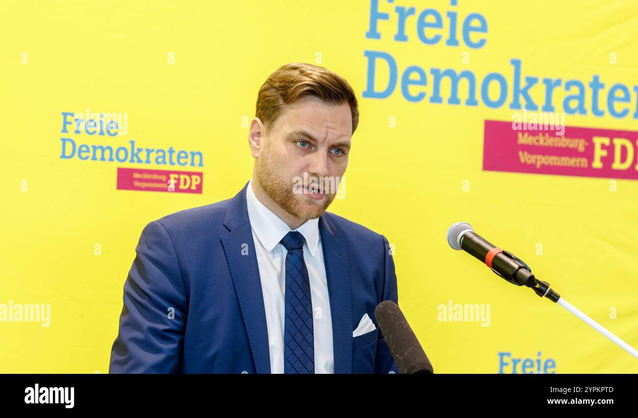 Schwerin, Germany. 30th Nov, 2024. Sebastian Adler delivers his ...