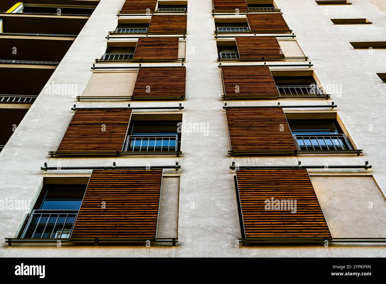 Industrial Facade with Repetitive Yellow Wooden Shutters Creating a ...