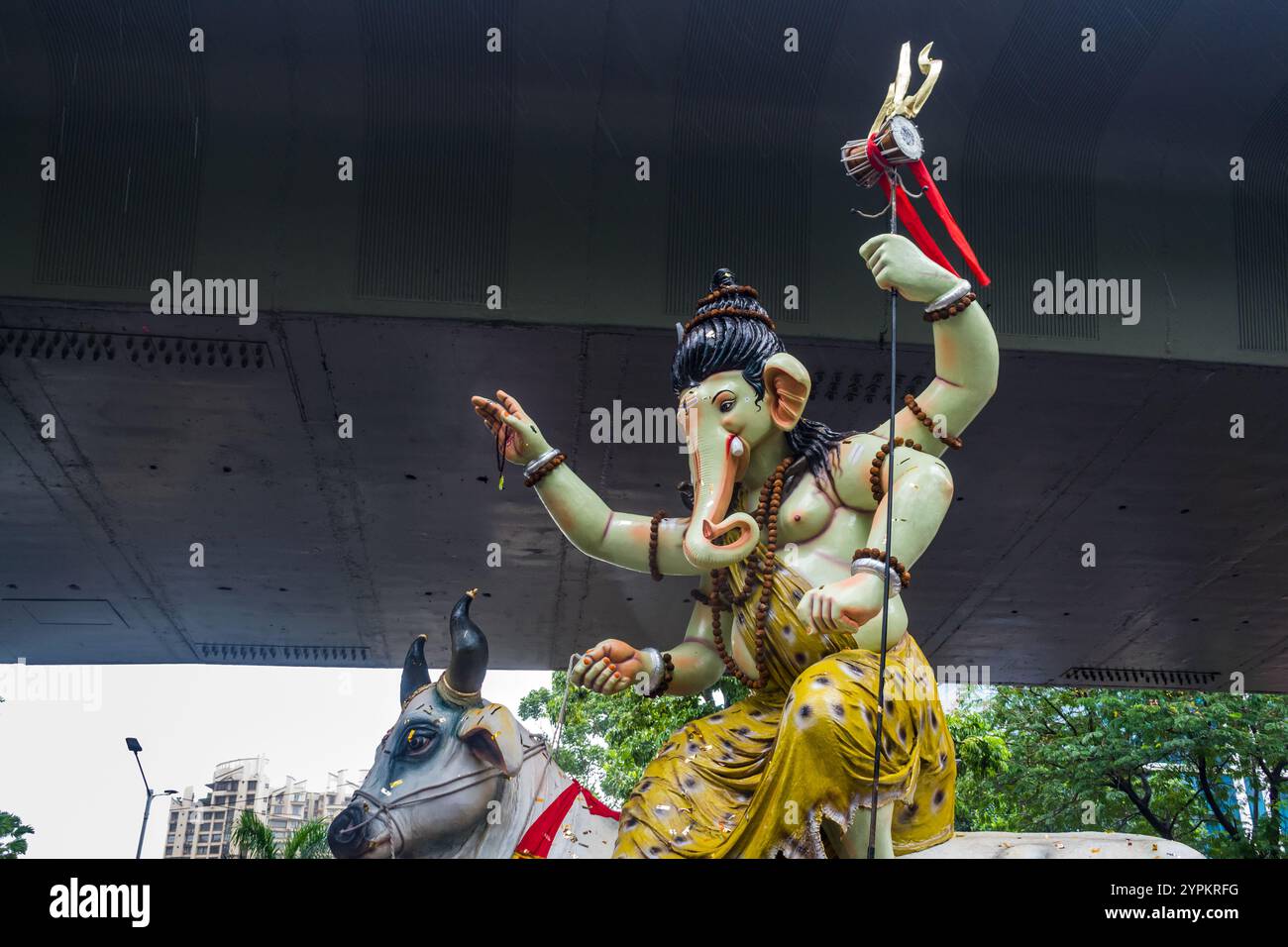 A beautiful idol of Lord Ganpati being displayed in a procession called ...