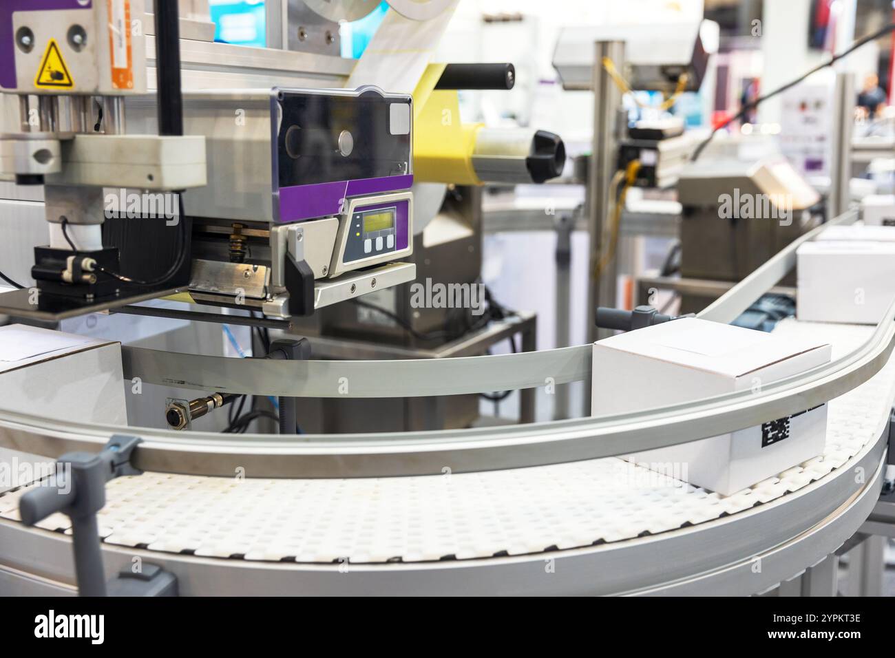 Packages boxes on conveyor during automated production manufacturing ...