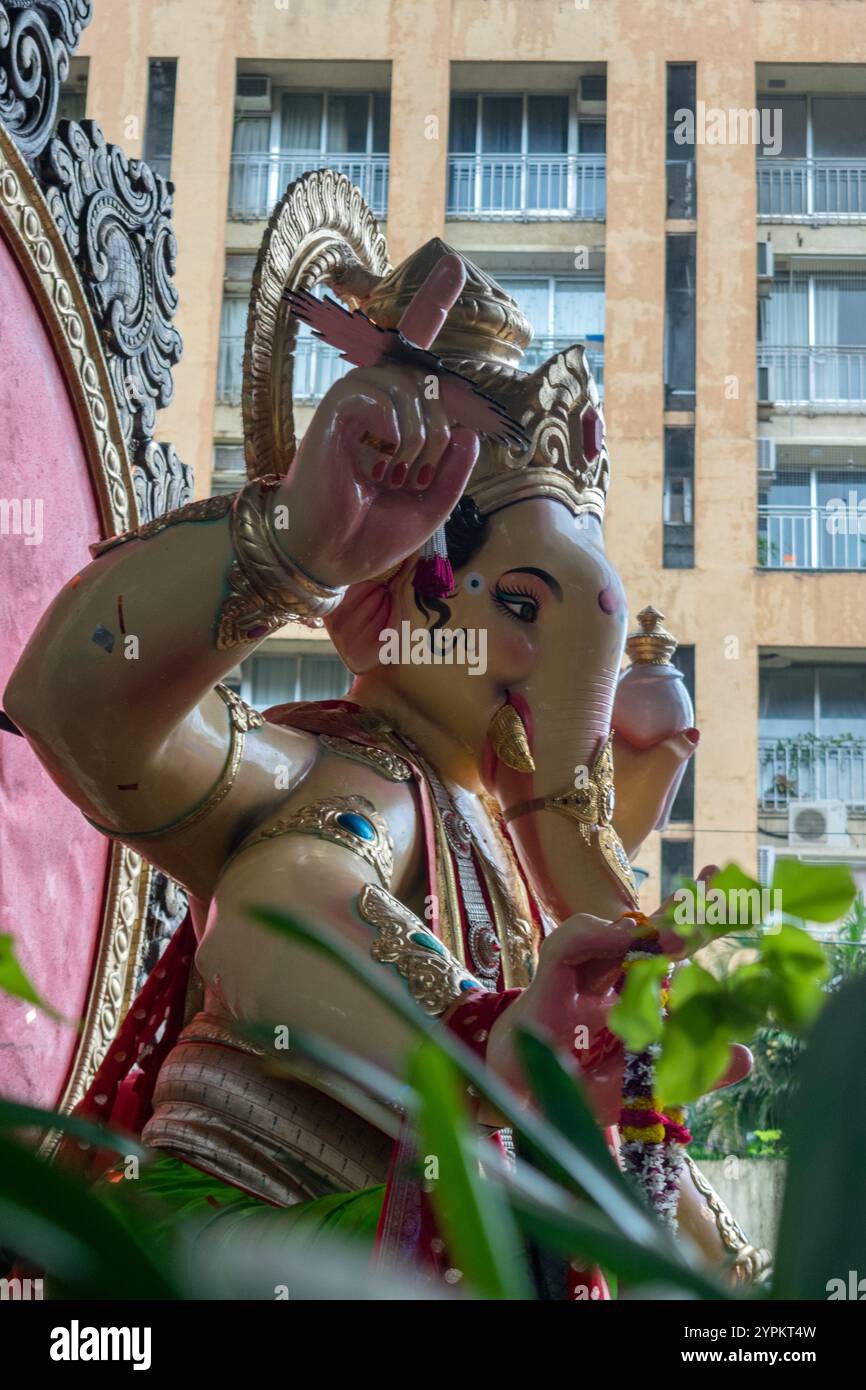 A beautiful idol of Lord Ganpati being displayed in a procession called ...