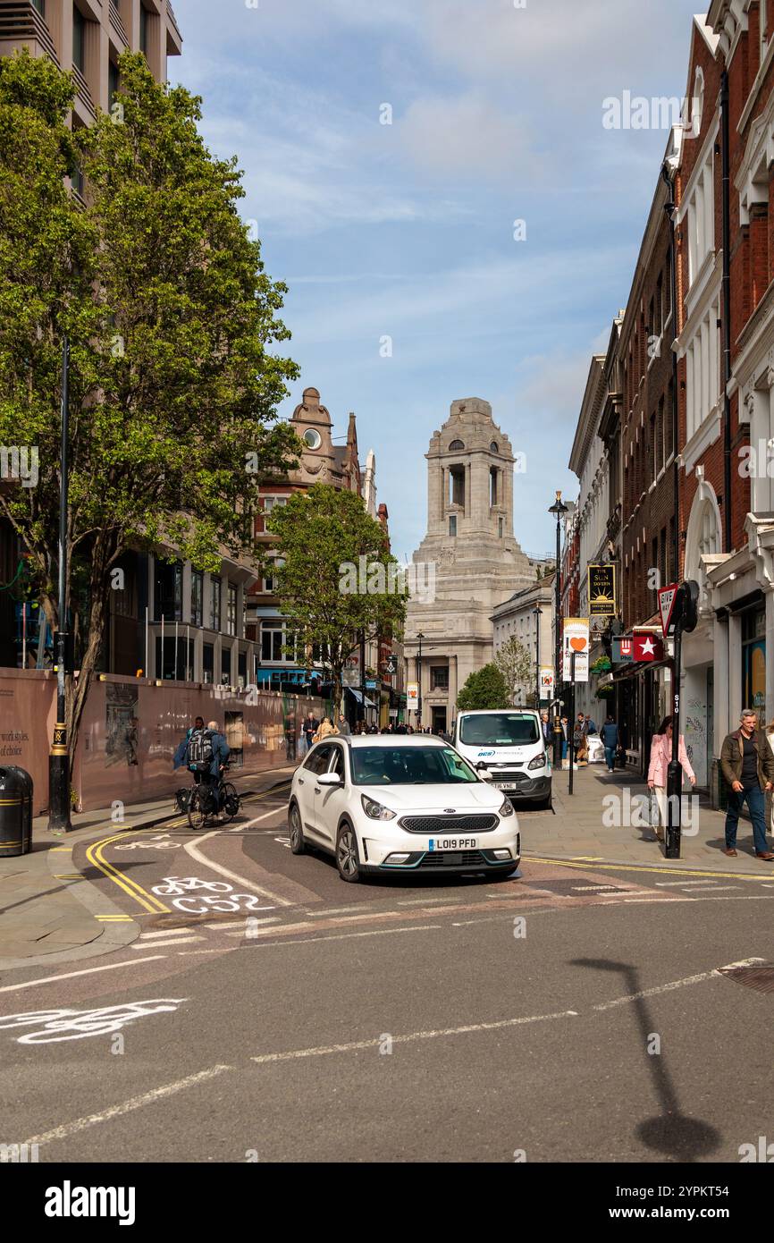 Kia Niro hybrid SUV on London street with Freemasons' Hall's iconic art ...