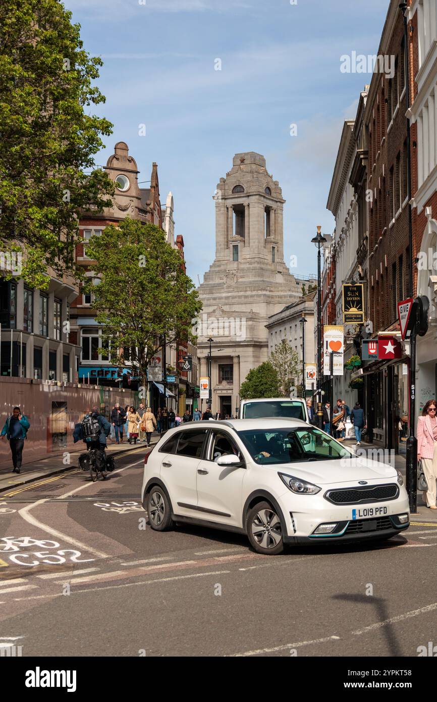 Kia Niro hybrid SUV on London street with Freemasons' Hall's iconic art ...