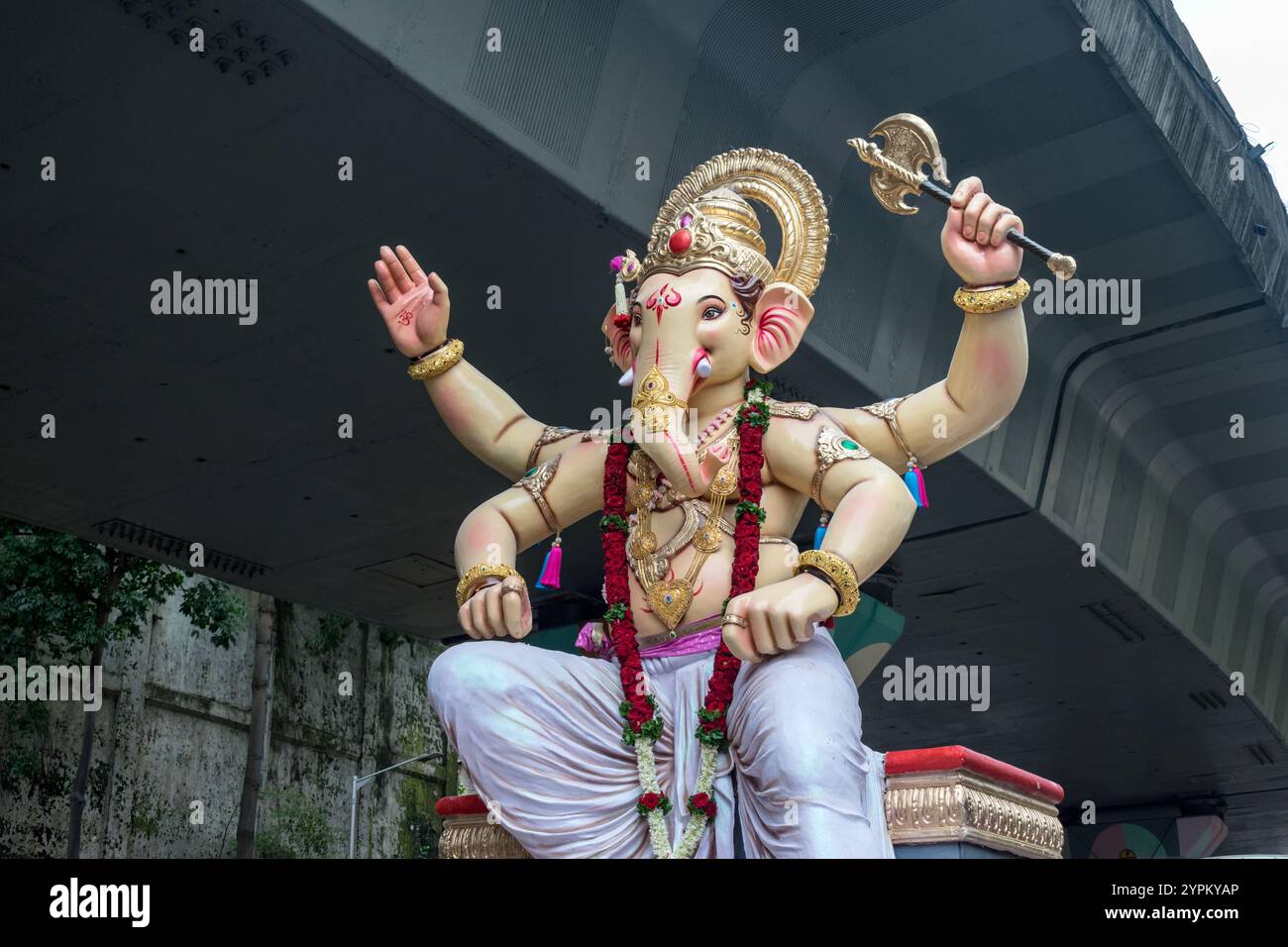 A beautiful idol of Lord Ganpati being displayed in a procession called ...