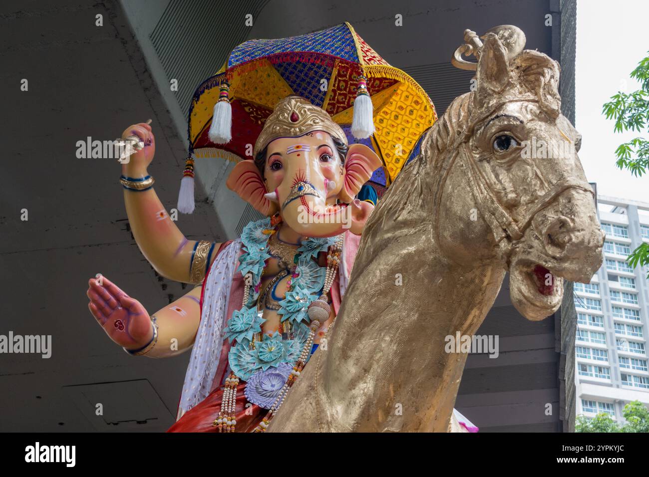 A beautiful idol of Lord Ganpati being displayed in a procession called ...