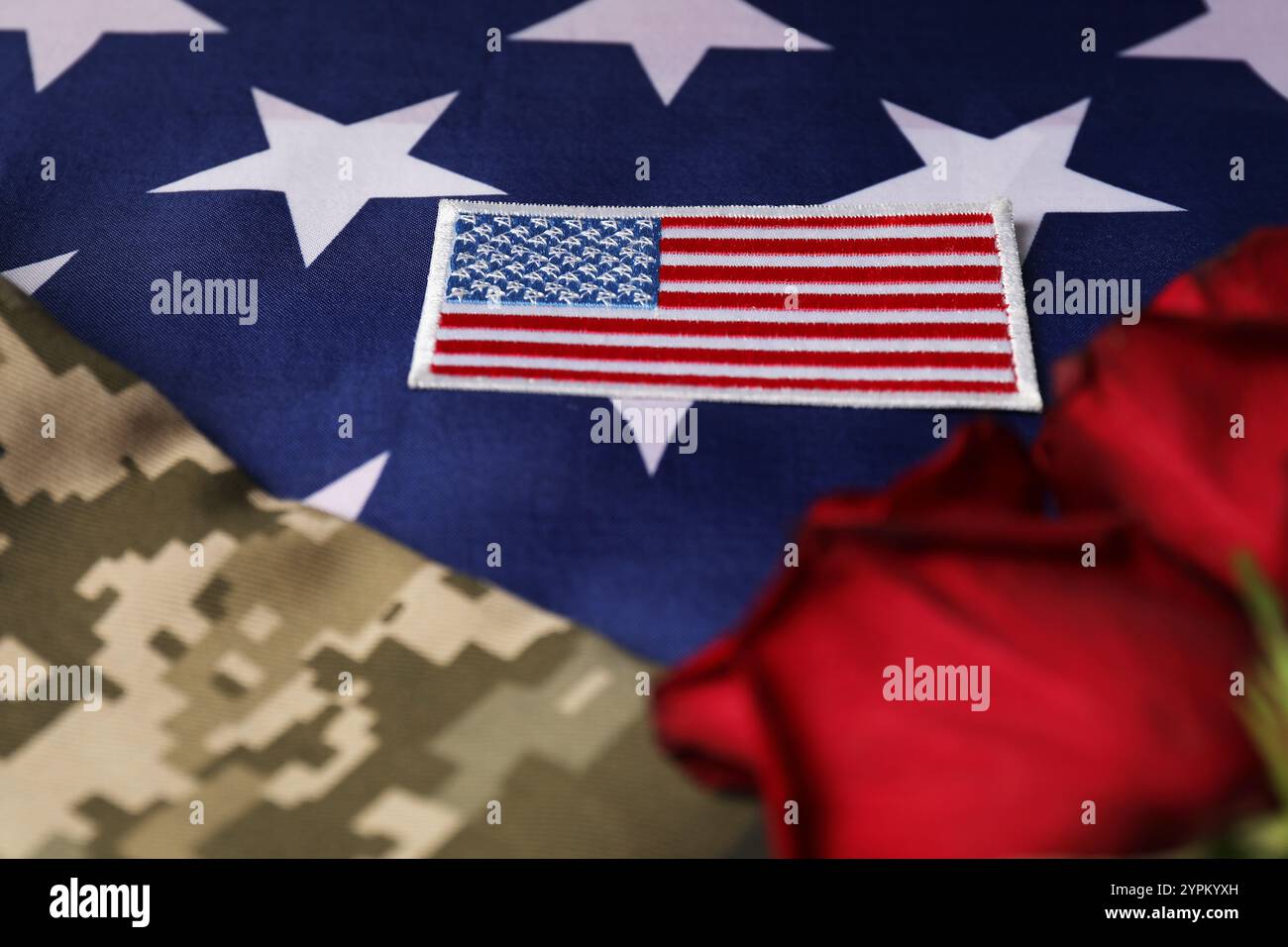 Veterans day. USA army patch, rose flowers and military uniform on ...
