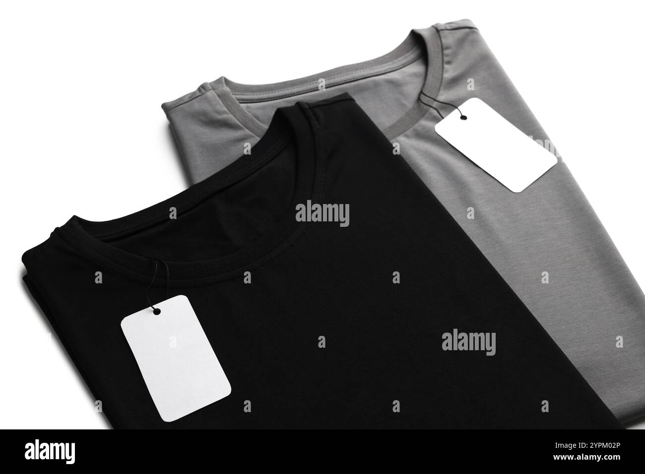 Black and grey t-shirts with tags on white background. Mockup for ...