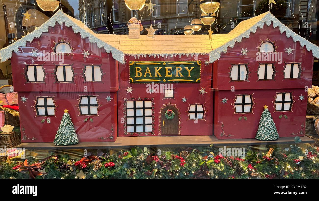 A meticulously crafted Christmas bakery display features three ...