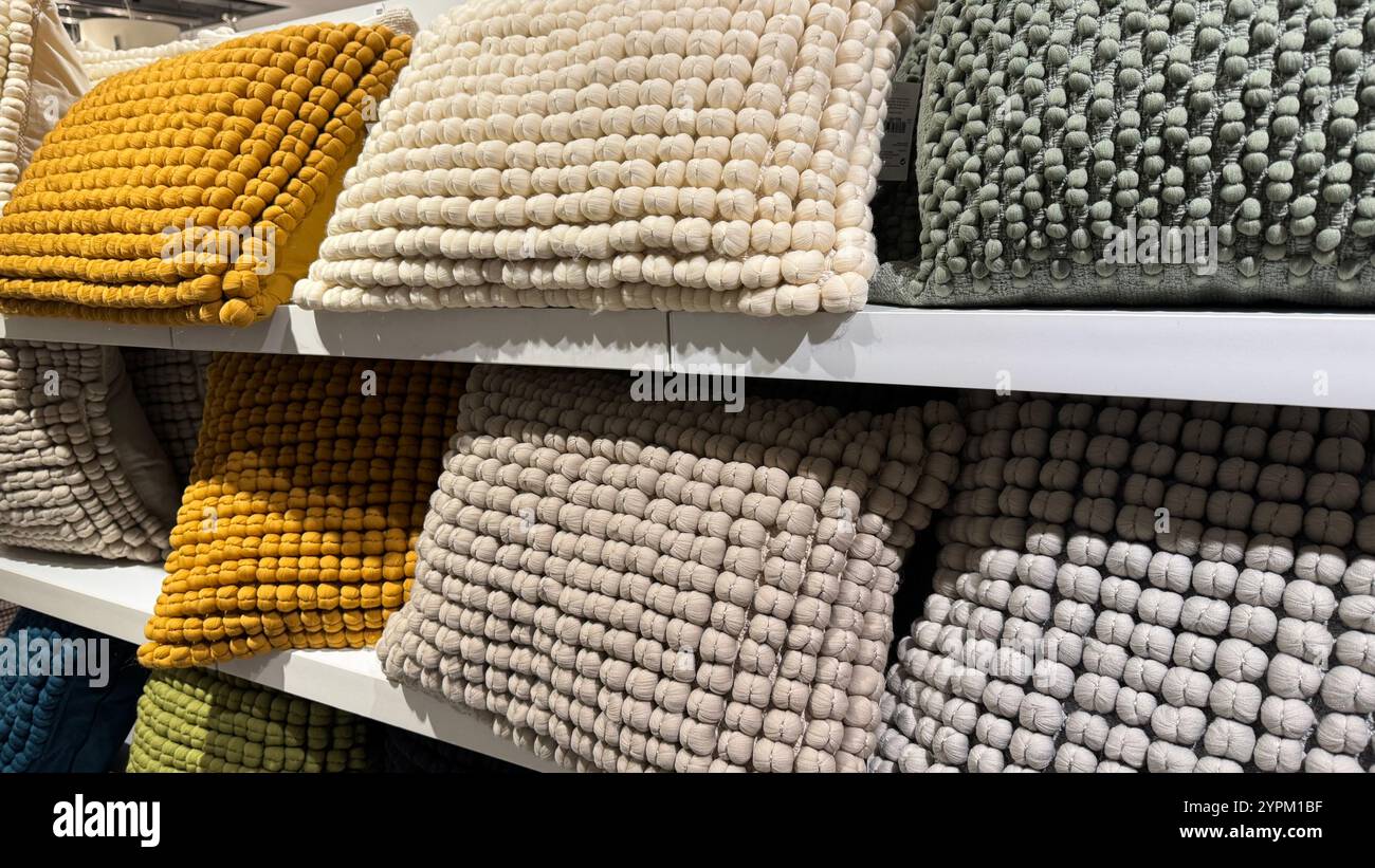 Multiple textured throw pillows in beige, mustard yellow, and sage ...