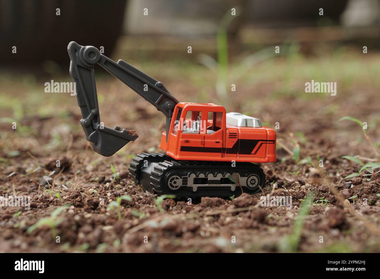 Orange backhoe moving dirt hi-res stock photography and images - Alamy
