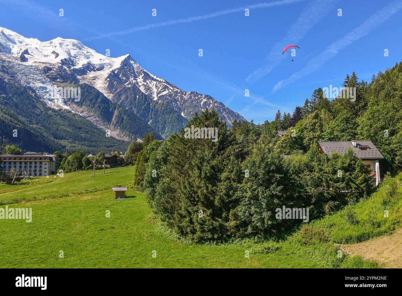 Mountain landscape with a chalet surrounded by woods and the Mont Blanc ...