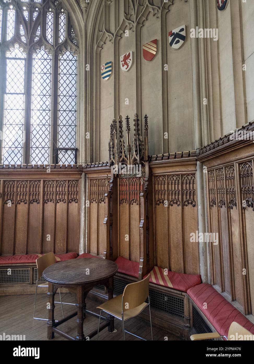 Gothic Style Interior with Ornate Wooden Paneling, Heraldic Shields ...
