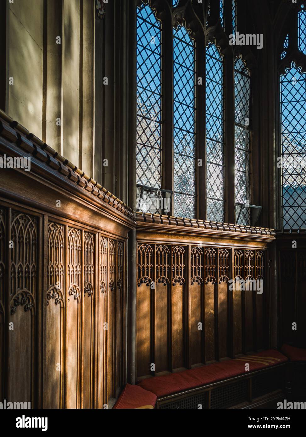 Gothic Window with Sunlit Wooden Paneling and Intricate Details in a ...