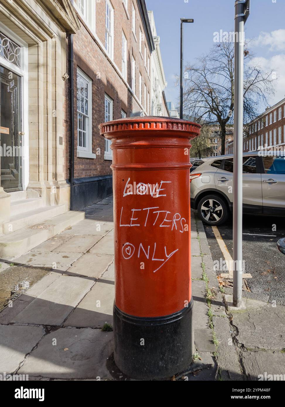 Red British Postbox with Handwritten "Love Letters Only" Graffiti on an ...