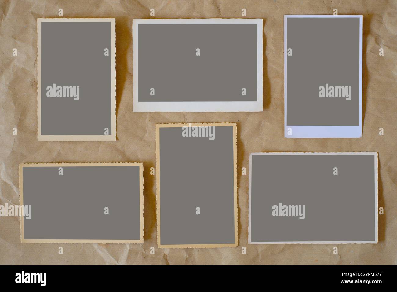 Old empty photo frames, vintage photo prints on crumpled paper with ...