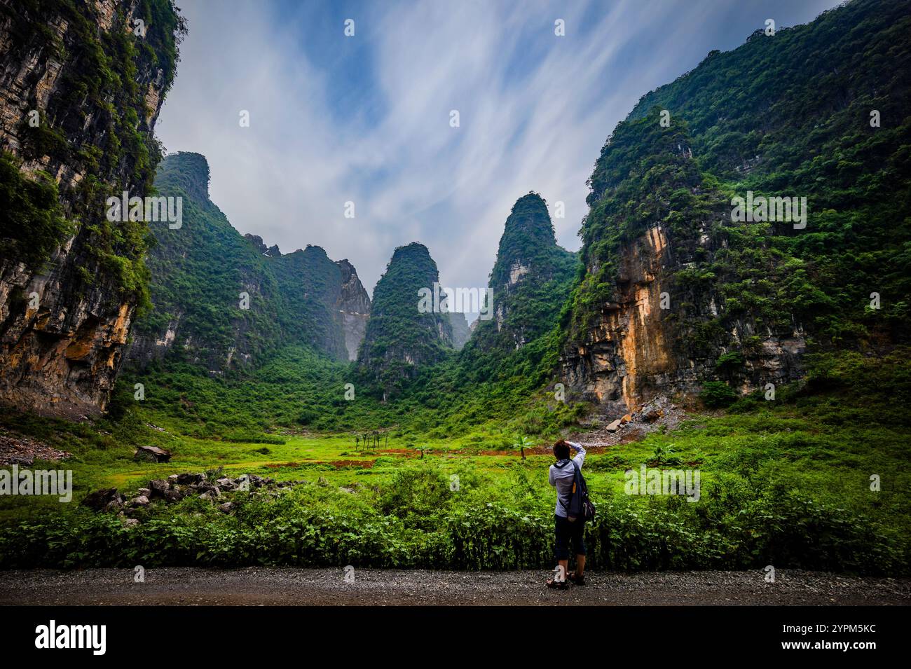 Female tourist captures the beauty of the Karst landscape Yangshou ...