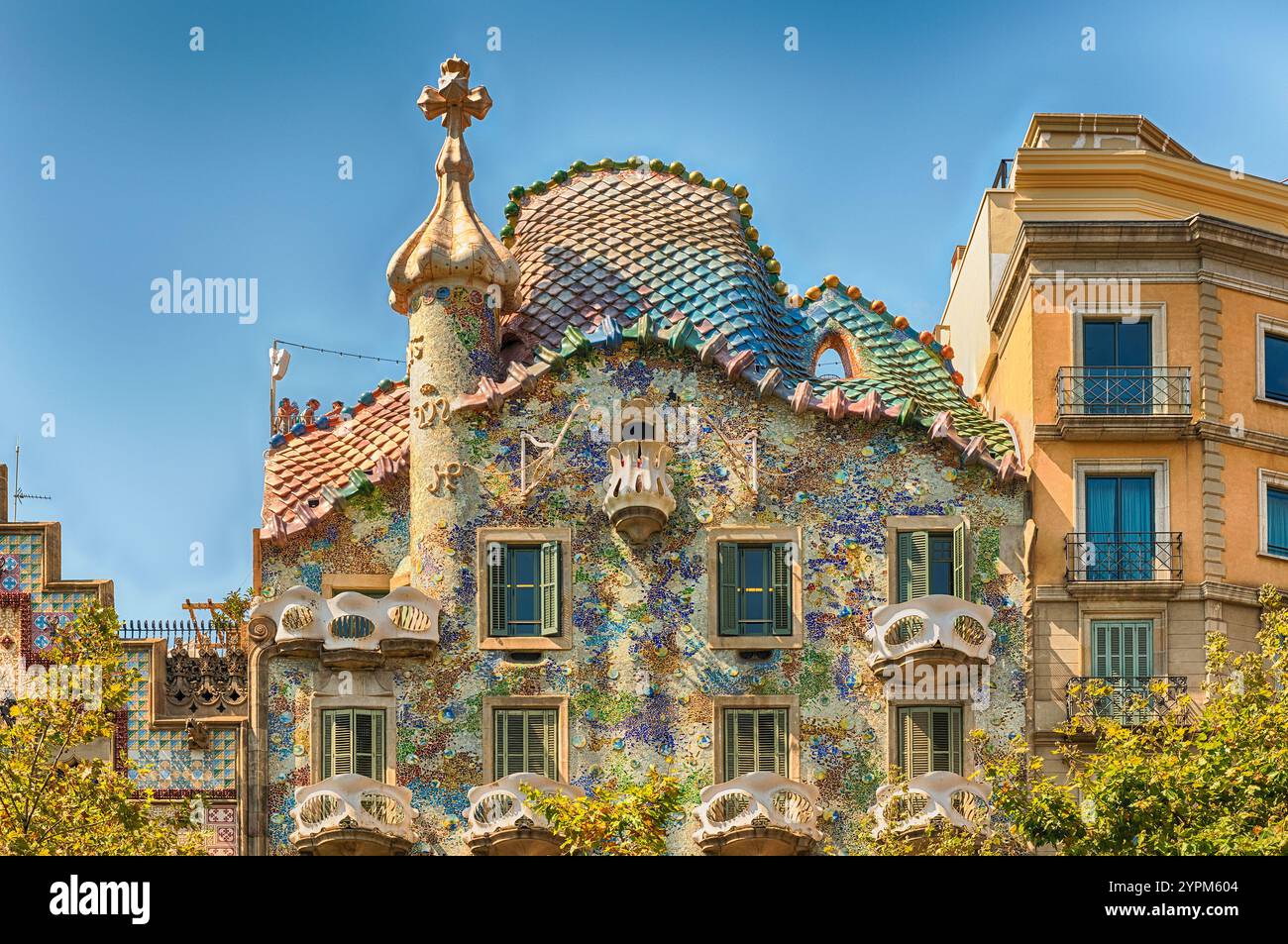 BARCELONA - AUGUST 9: Facade and Dragon's tile rooftop of Casa Batllo ...