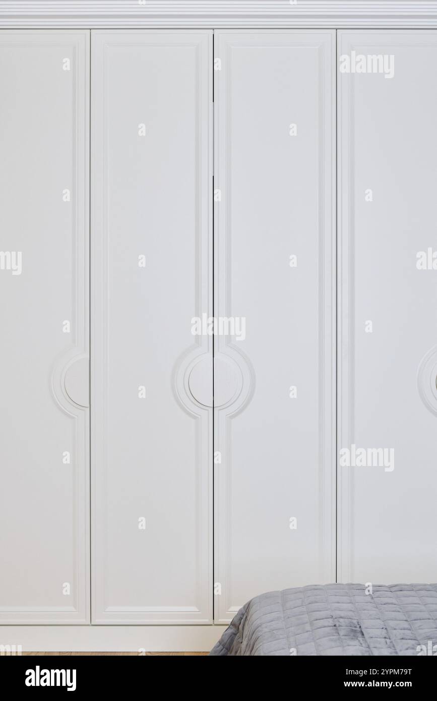 Contemporary Modern White Wardrobe Featuring Stylish Circular Handles ...