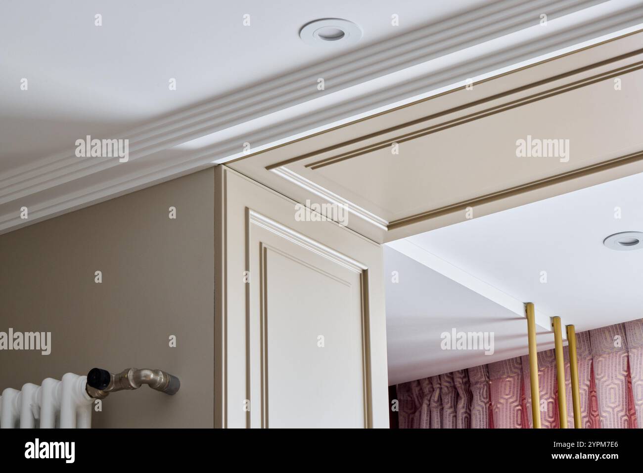 An Elegant Interior Corner Designed with Beautiful Crown Molding and ...