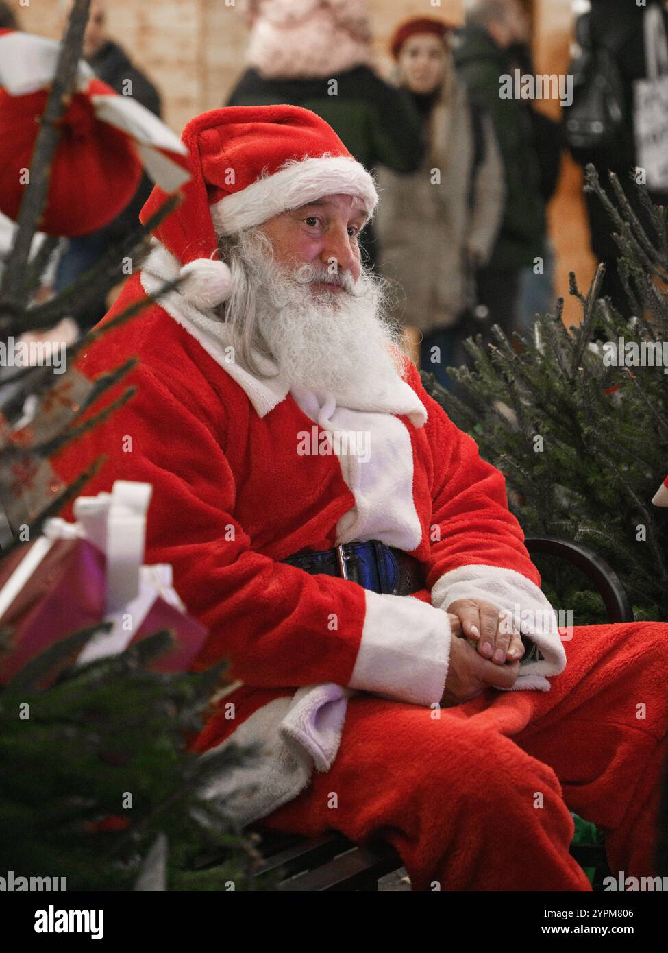 Santa Claus wearing hat sitting at Christmas market in Sofia, Bulgaria ...