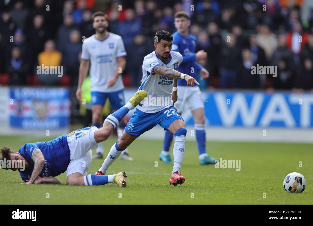 St Johnstone's Graham Carey (left) and Rangers' Jefte in action during ...