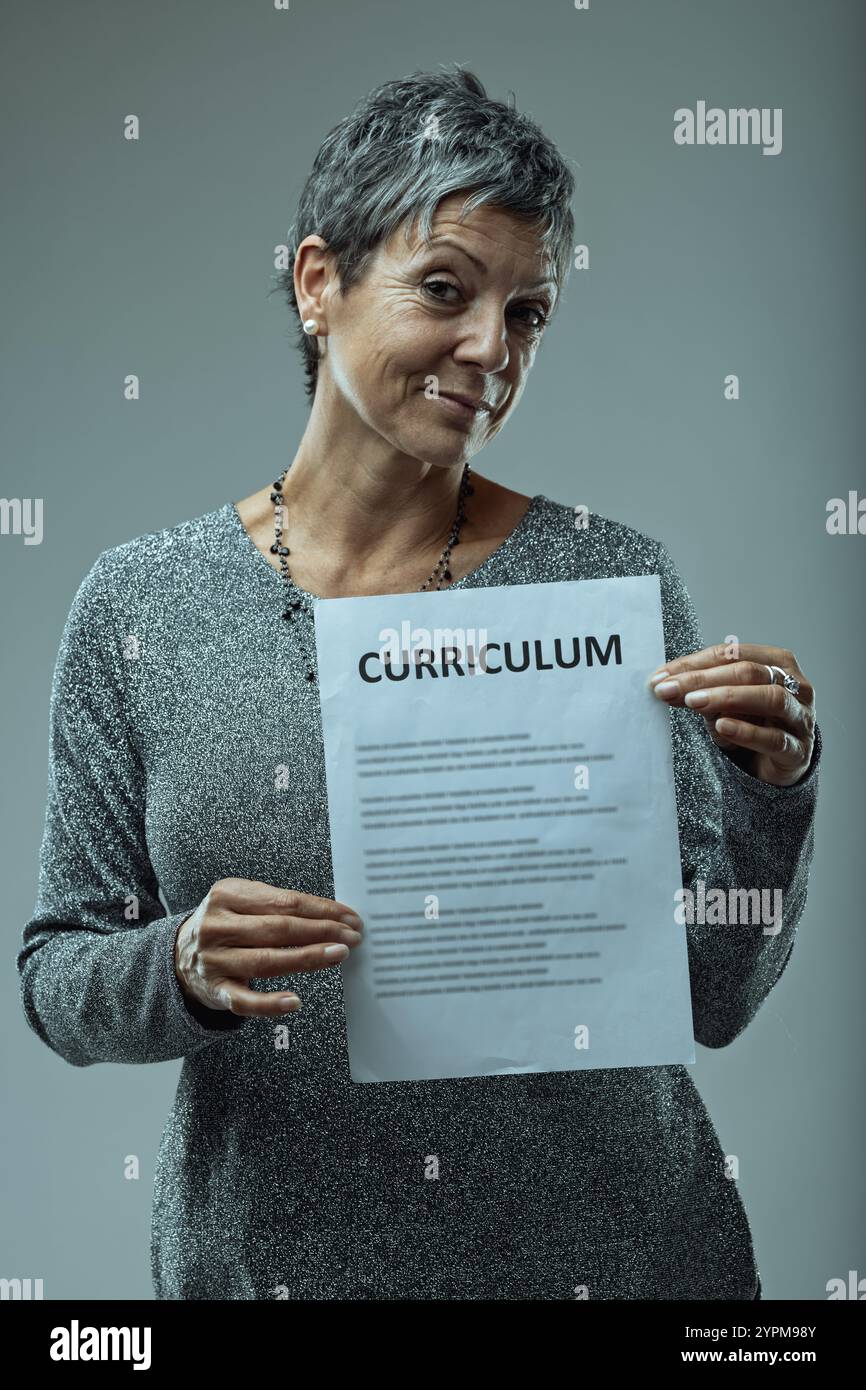 Confident mature woman showcasing cv for job, exuding professionalism ...