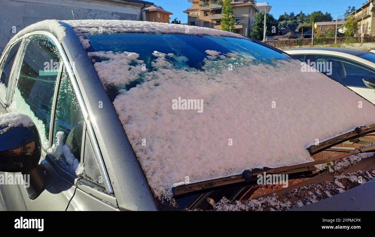 Close up of snow on car Dirty car covered with thin layer of snow on ...