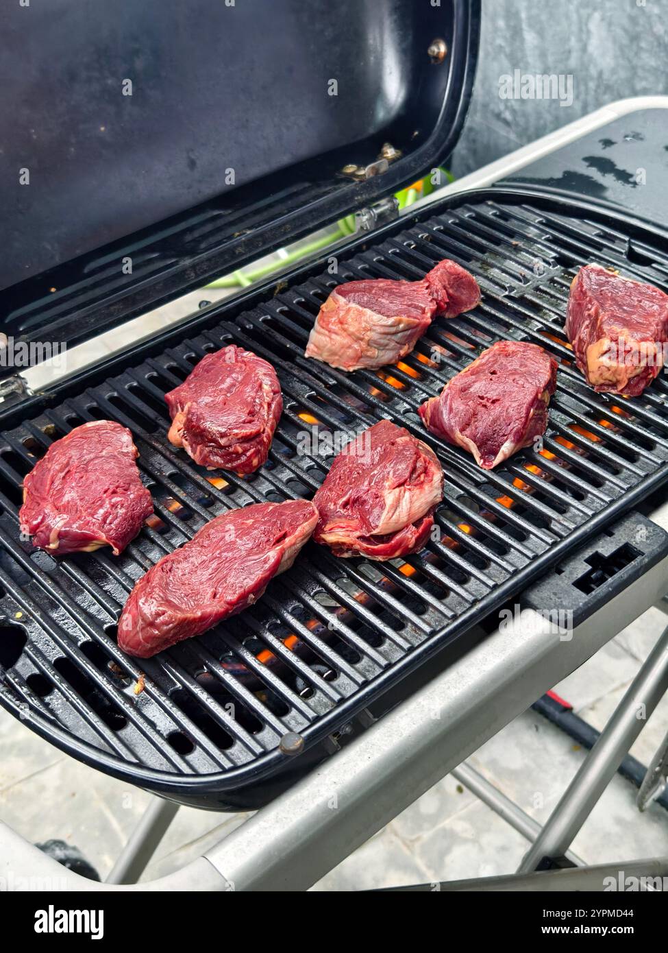Sizzling grilled meat that showcases a perfect char Stock Photo - Alamy