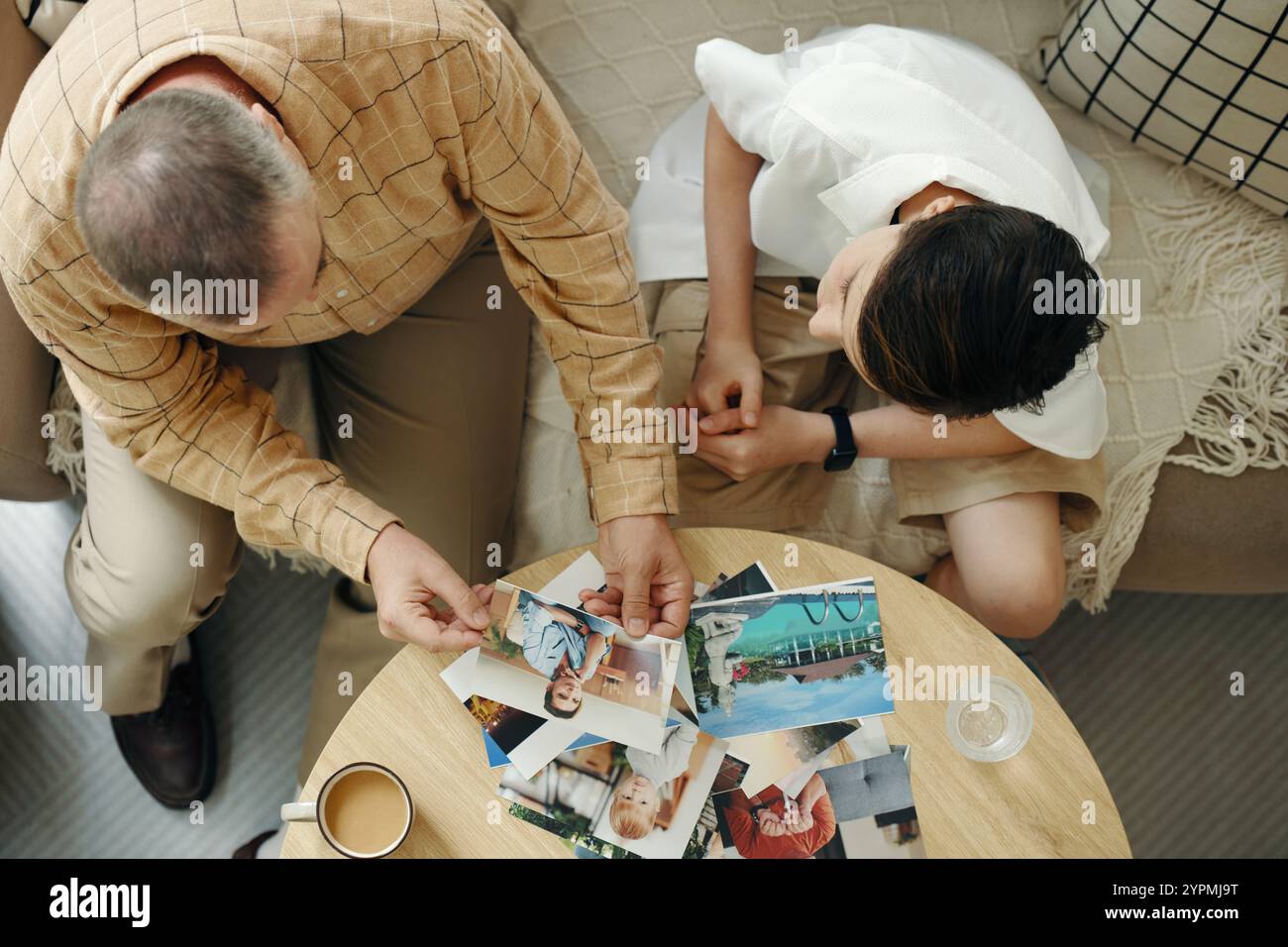 Granddad Showing Family Album To Grandchild Stock Photo - Alamy